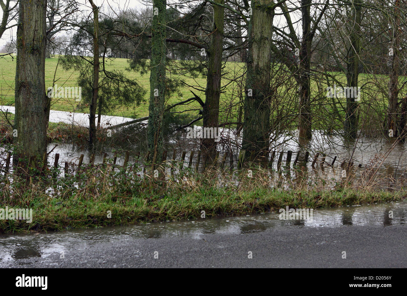 Flood water running down the side of a slope and flooding the verge of ...
