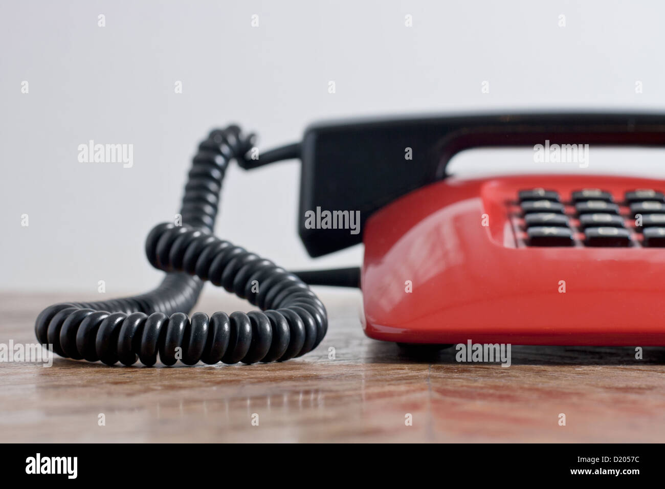 Old fashioned telephone with receiver on the hook Stock Photo - Alamy