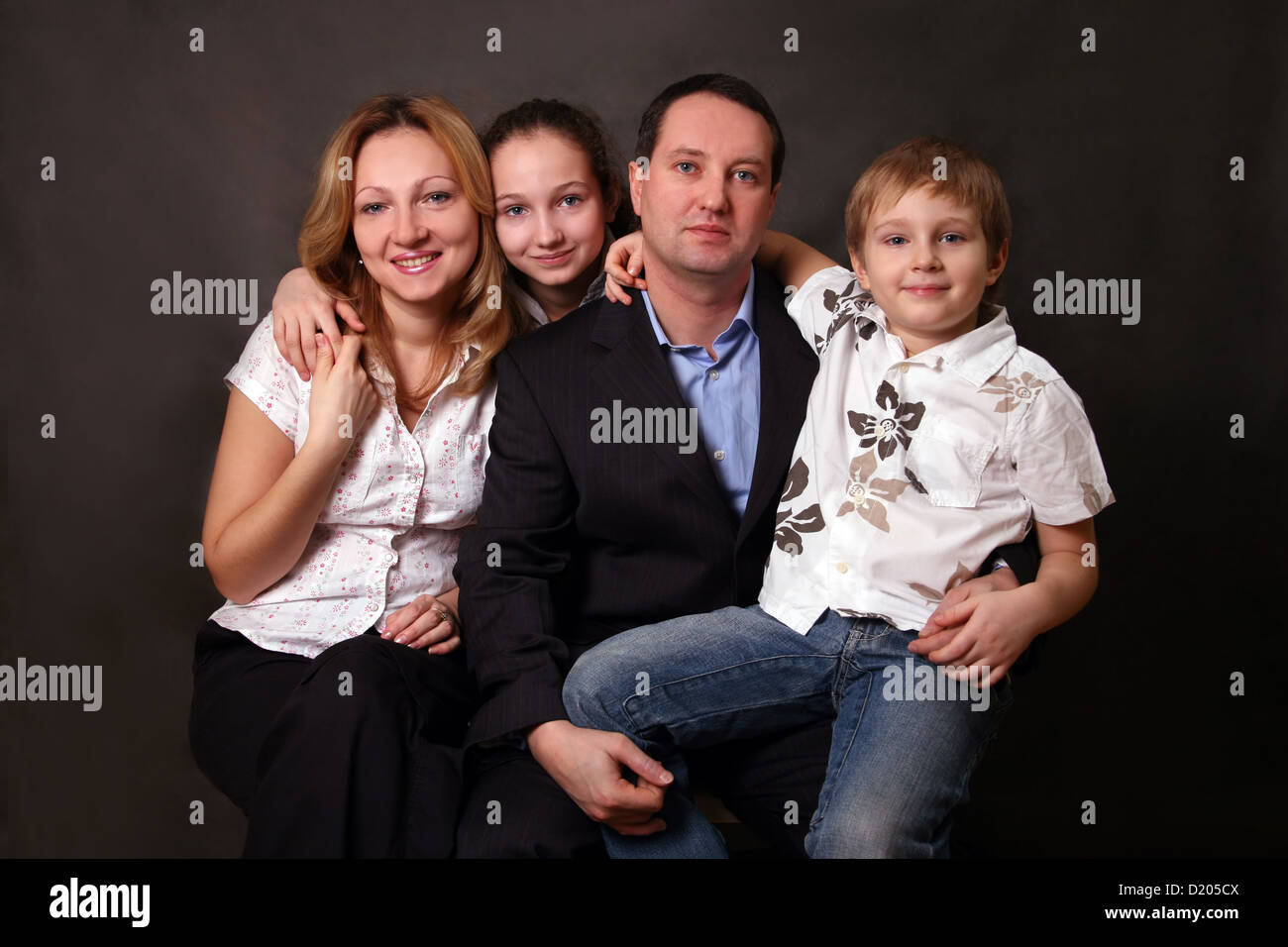 Portrait of parents and children in studio Stock Photo - Alamy