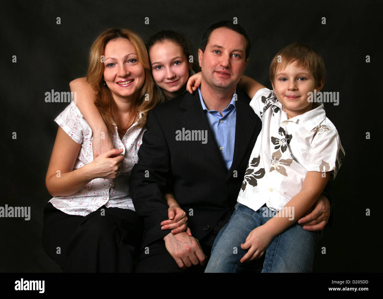Portrait of parents and children in studio Stock Photo - Alamy