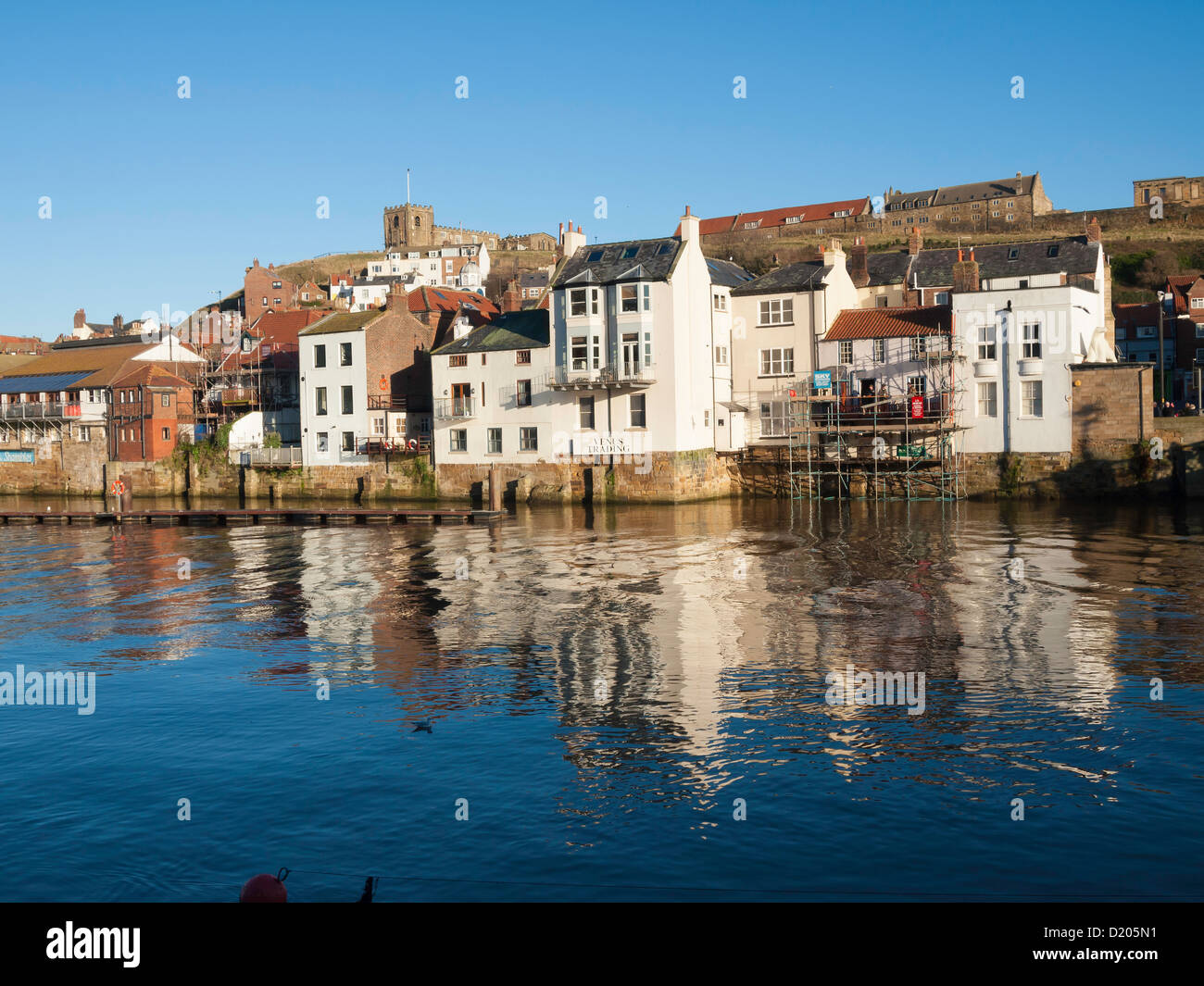 Whitby town east side and St Mary's church in winter sunlight. The ...