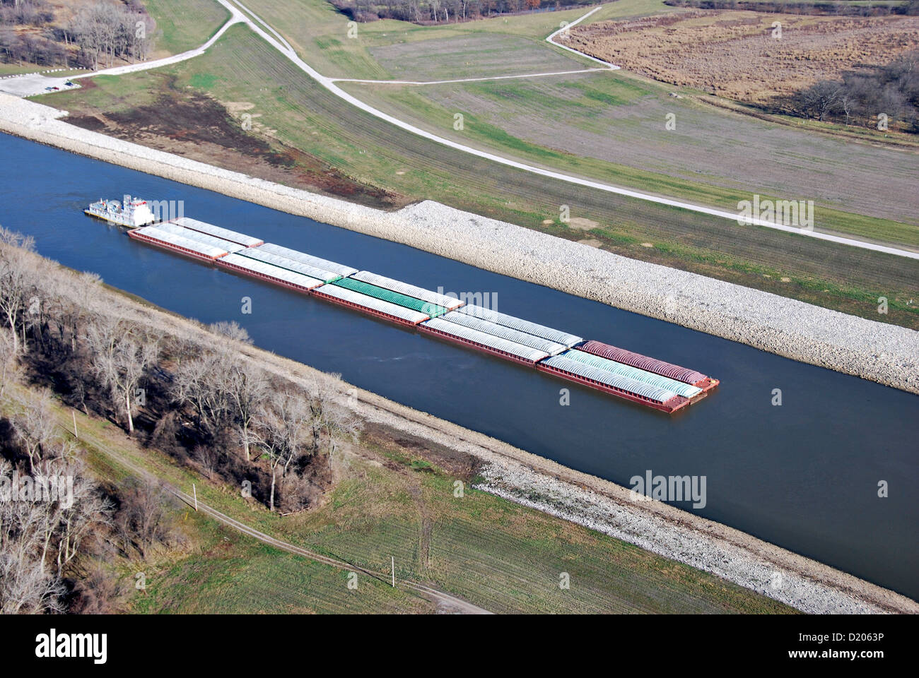 Aerial showing barges transiting through the Chain or Rocks Locks along the Mississippi River ...