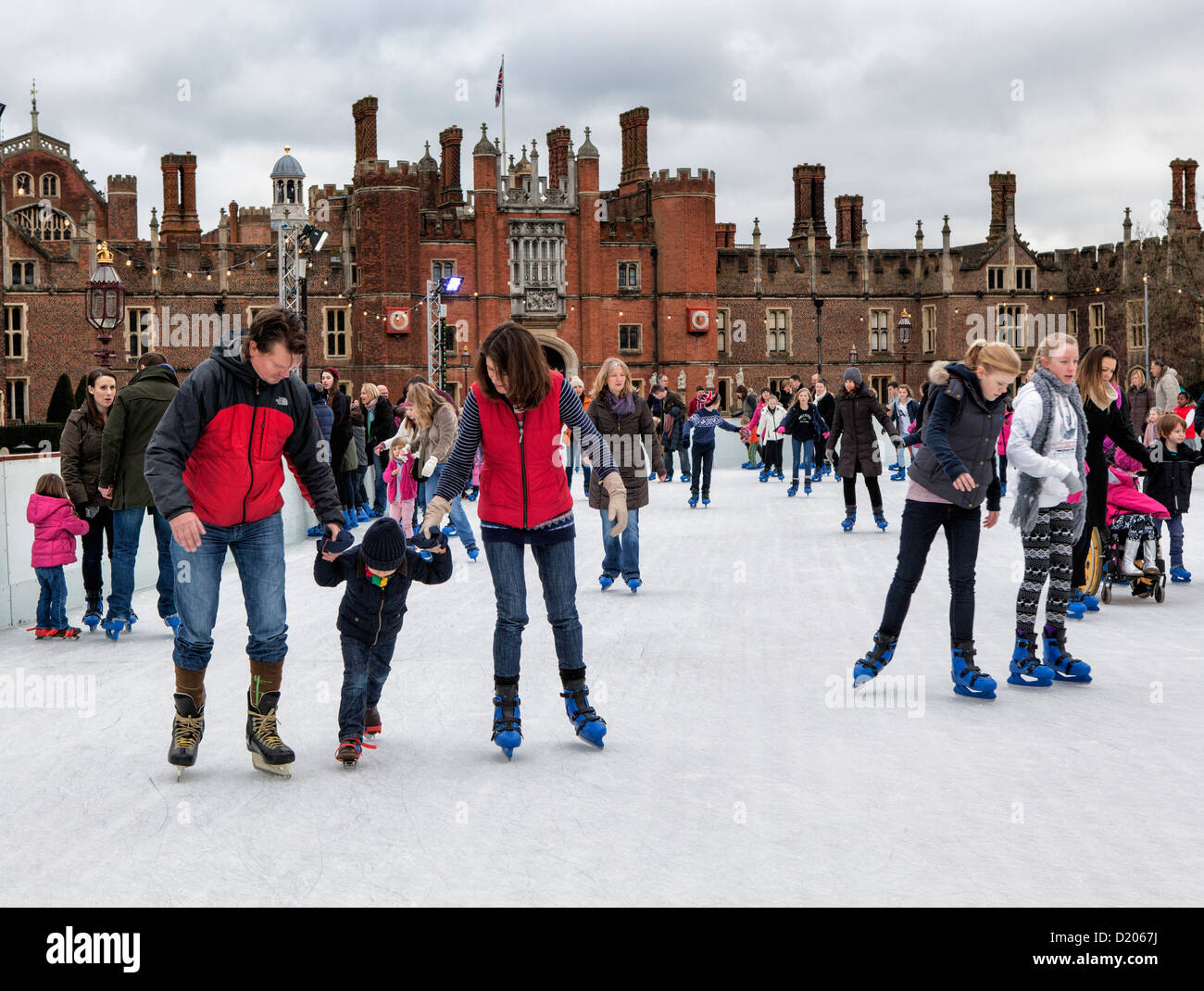 People skating on temporary ice rink at Hampton Court Palace, East ...