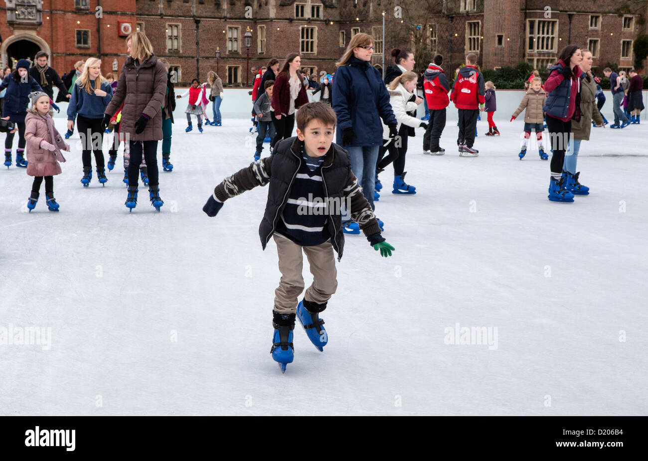 People skating on temporary ice rink at Hampton Court Palace, East ...