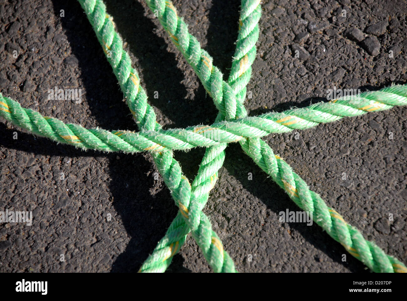Ropes on asphalt Stock Photo - Alamy