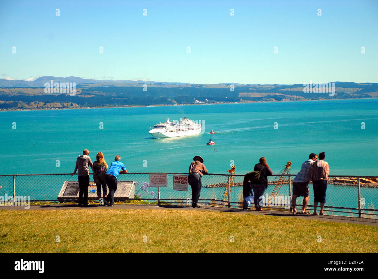 People watching cruise ship arrive at the Port of Napier New Zealand ...