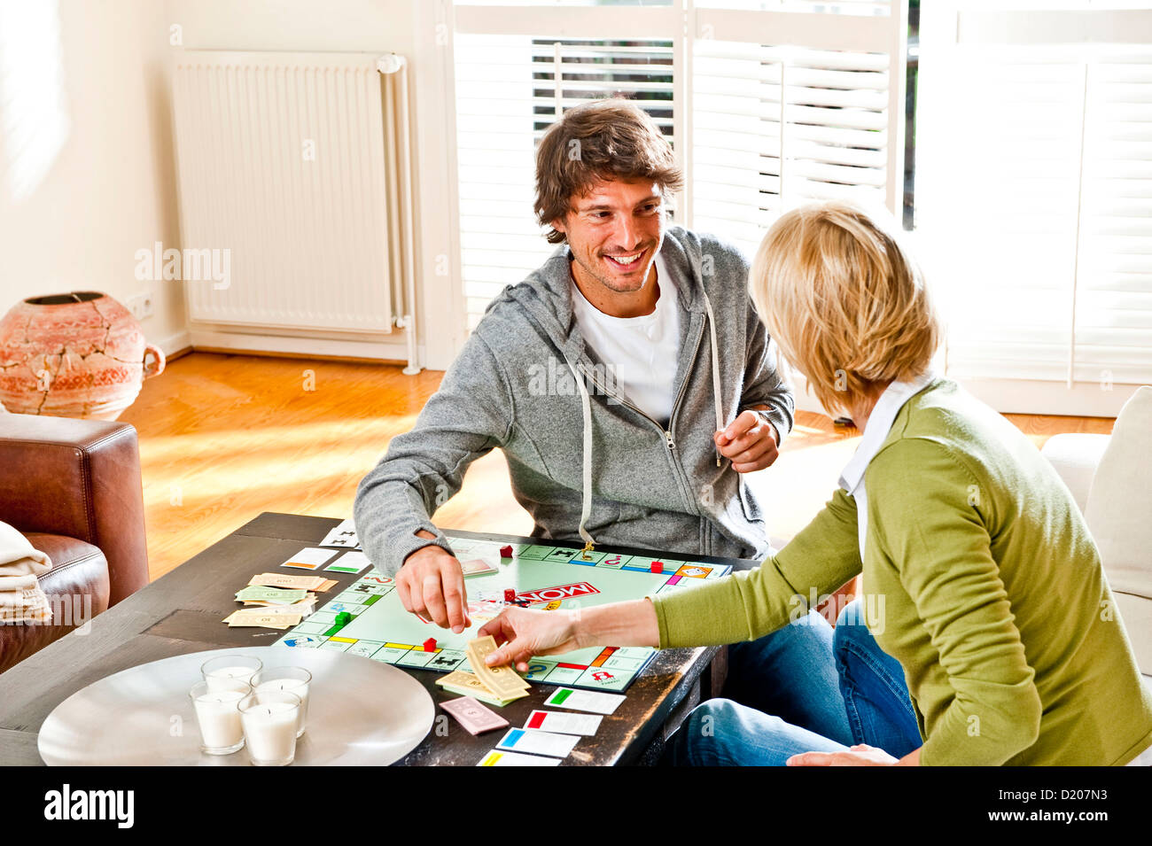 People playing monopoly hi-res stock photography and images - Alamy