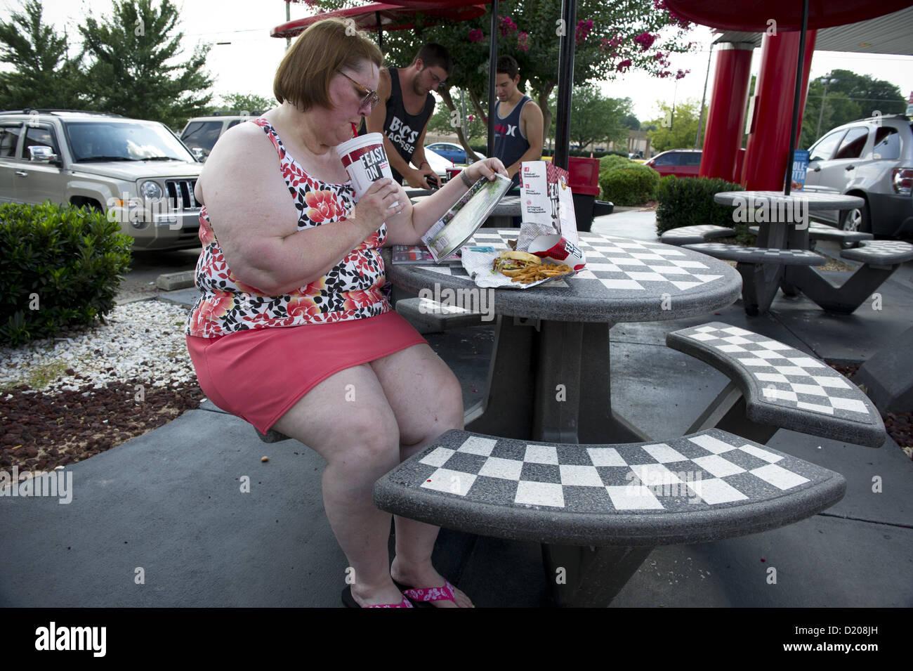Aug. 2, 2012 - Marietta, GA - Overweight middle-aged woman eats high ...
