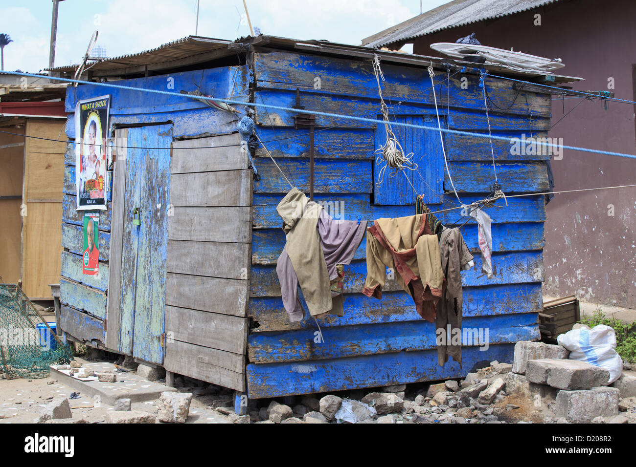 Simple blue shack in downtown Accra Stock Photo - Alamy