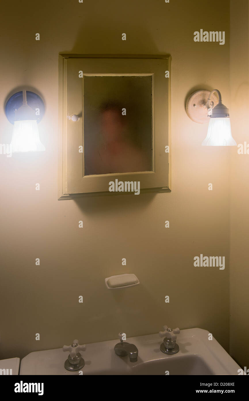 Man confronts his murky image in the mirror Stock Photo - Alamy