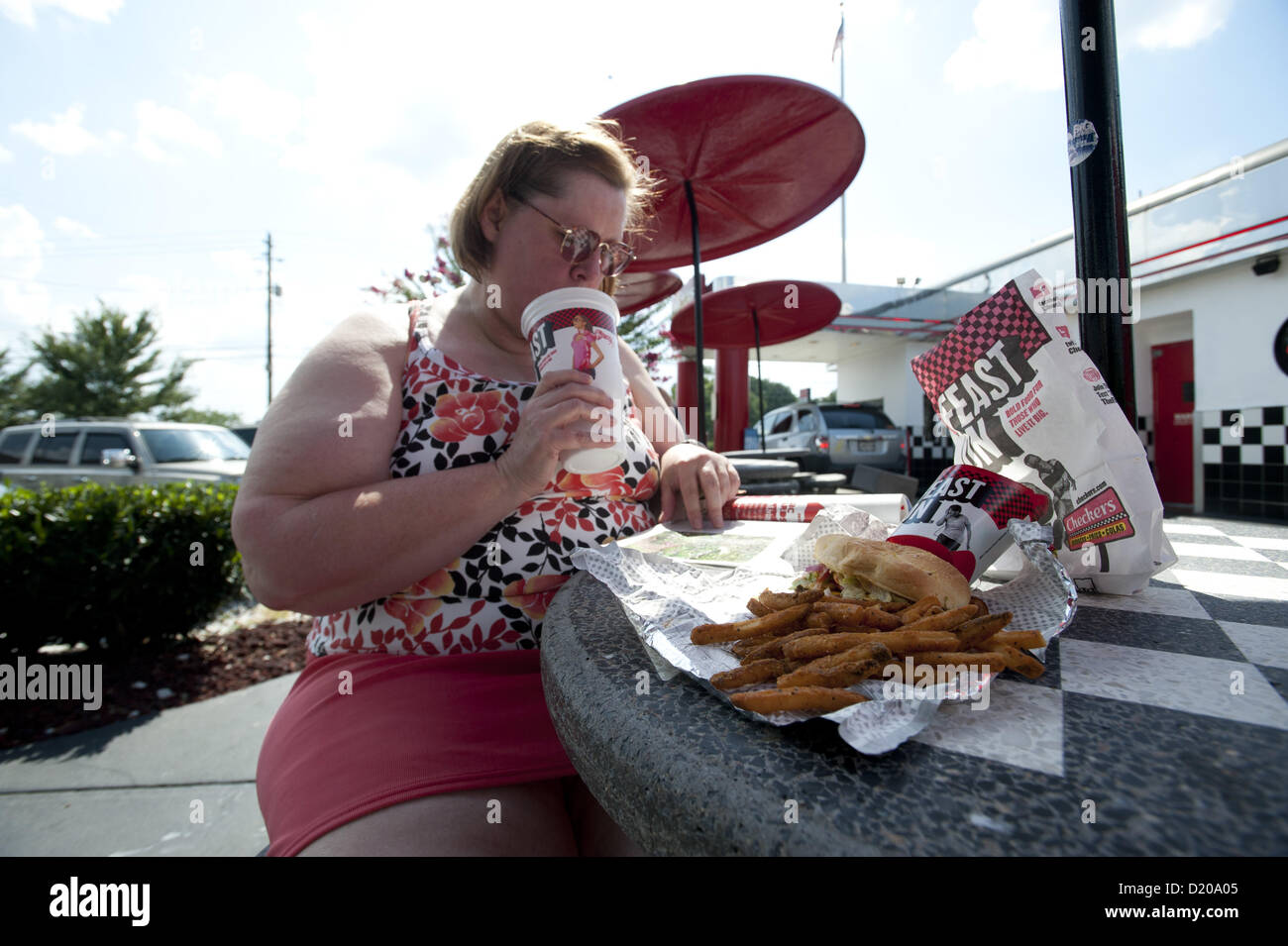 Aug. 2, 2012 - Marietta, GA - Overweight middle-aged woman eats high ...