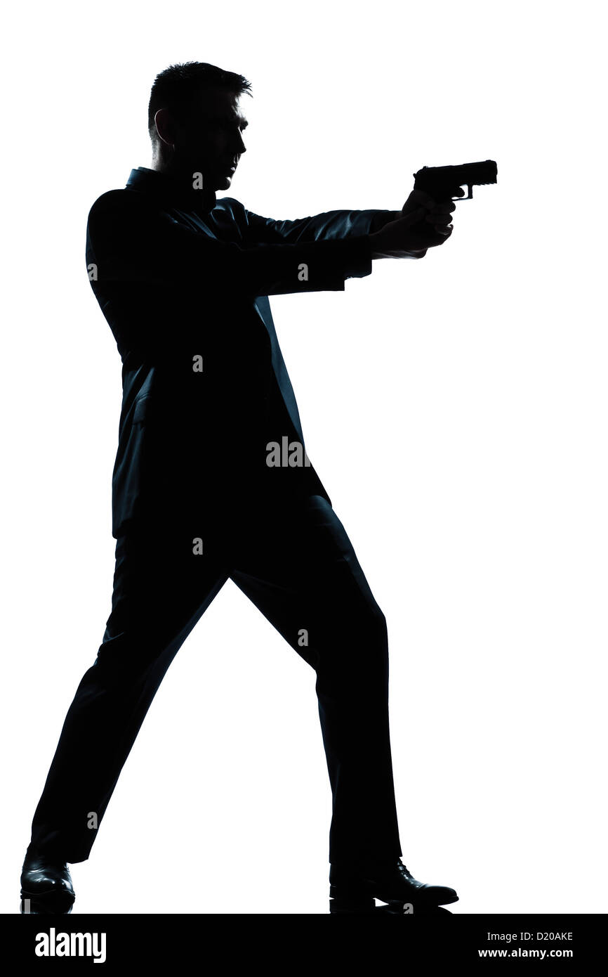 Side profile man holding gun Cut Out Stock Images & Pictures - Alamy