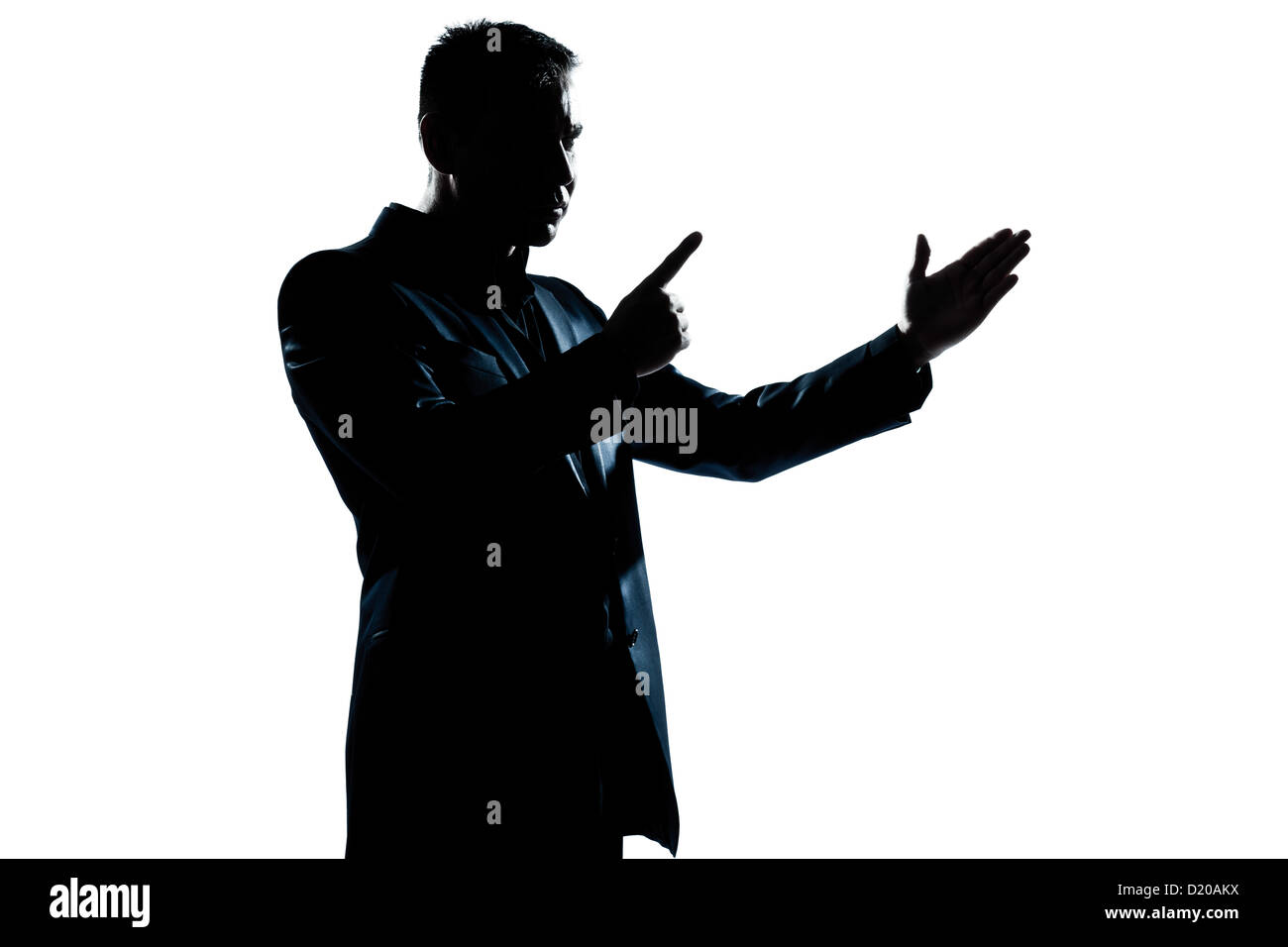 one caucasian man angry menacing portrait silhouette in studio isolated ...