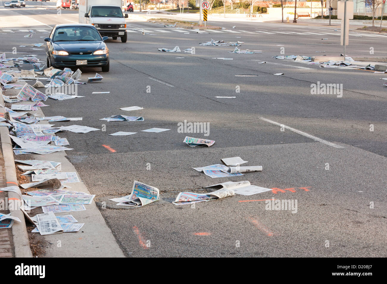Road littered with newspapers - USA Stock Photo - Alamy