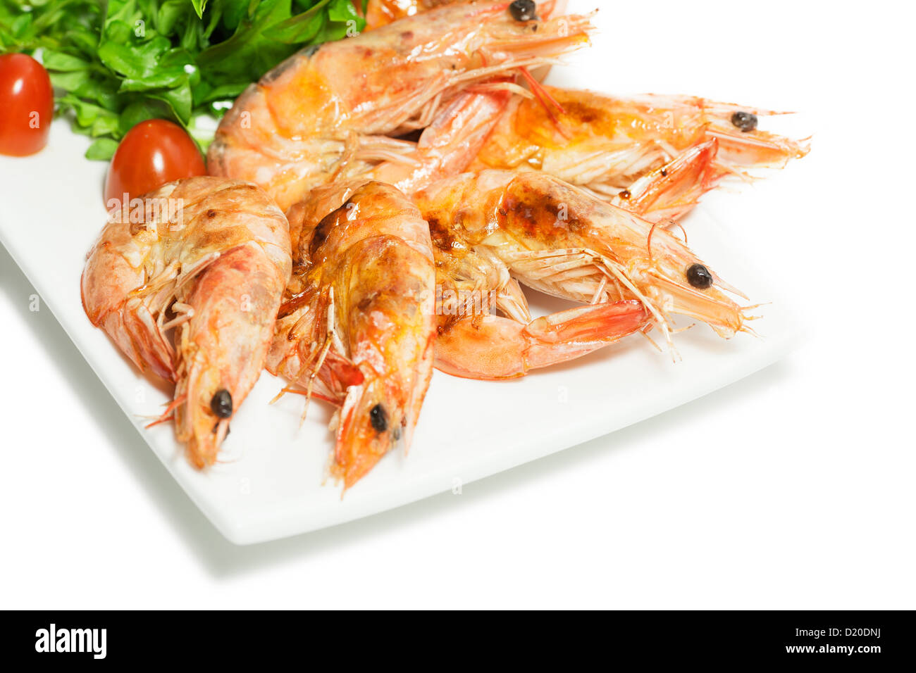 Roasted shrimps on the plate. Isolated on white Stock Photo - Alamy