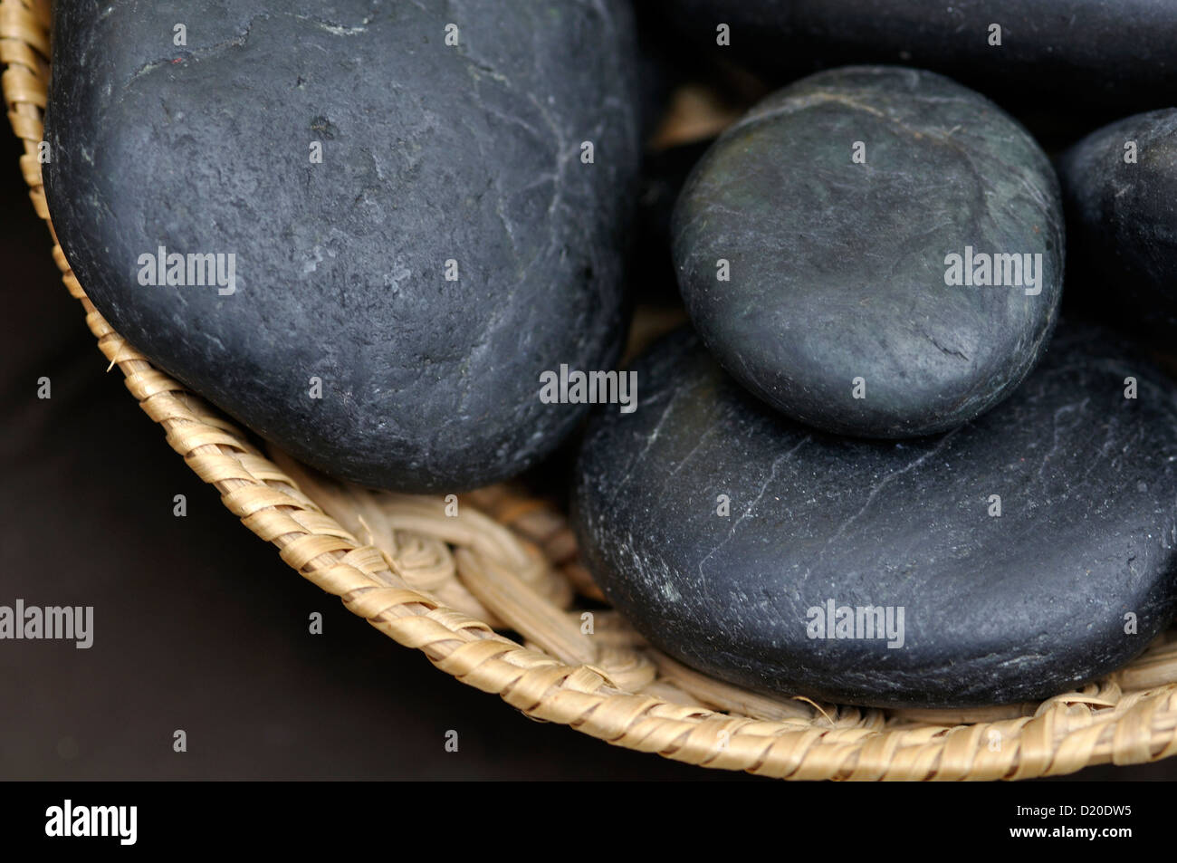 Volcanic Stones in Woven Basket Stock Photo - Alamy