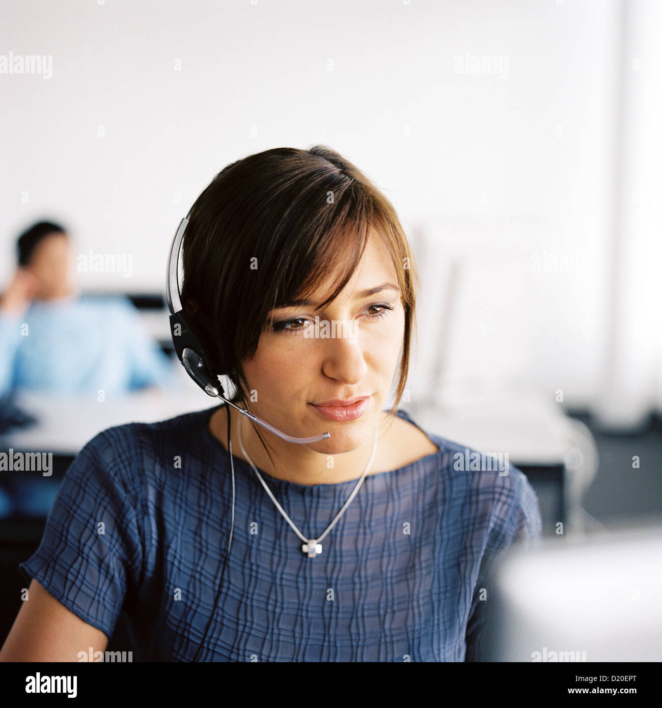 Closeup of call center employee at work License free except ads and ...