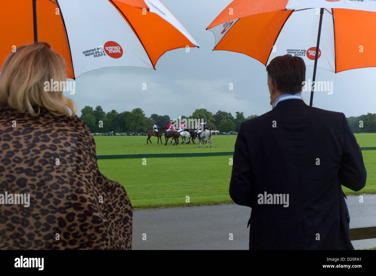 Spectators at polo match in the rain Stock Photo - Alamy
