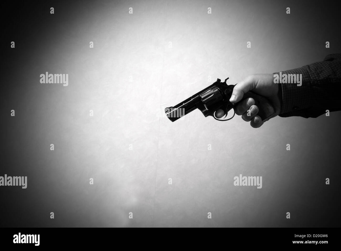 Hand with gun ready to shoot Stock Photo - Alamy