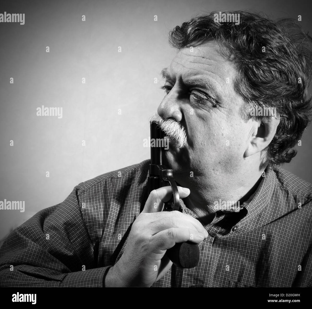 middle aged man with a revolver Stock Photo - Alamy