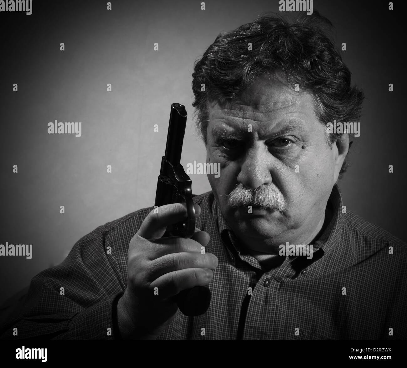 middle aged man with a revolver Stock Photo - Alamy