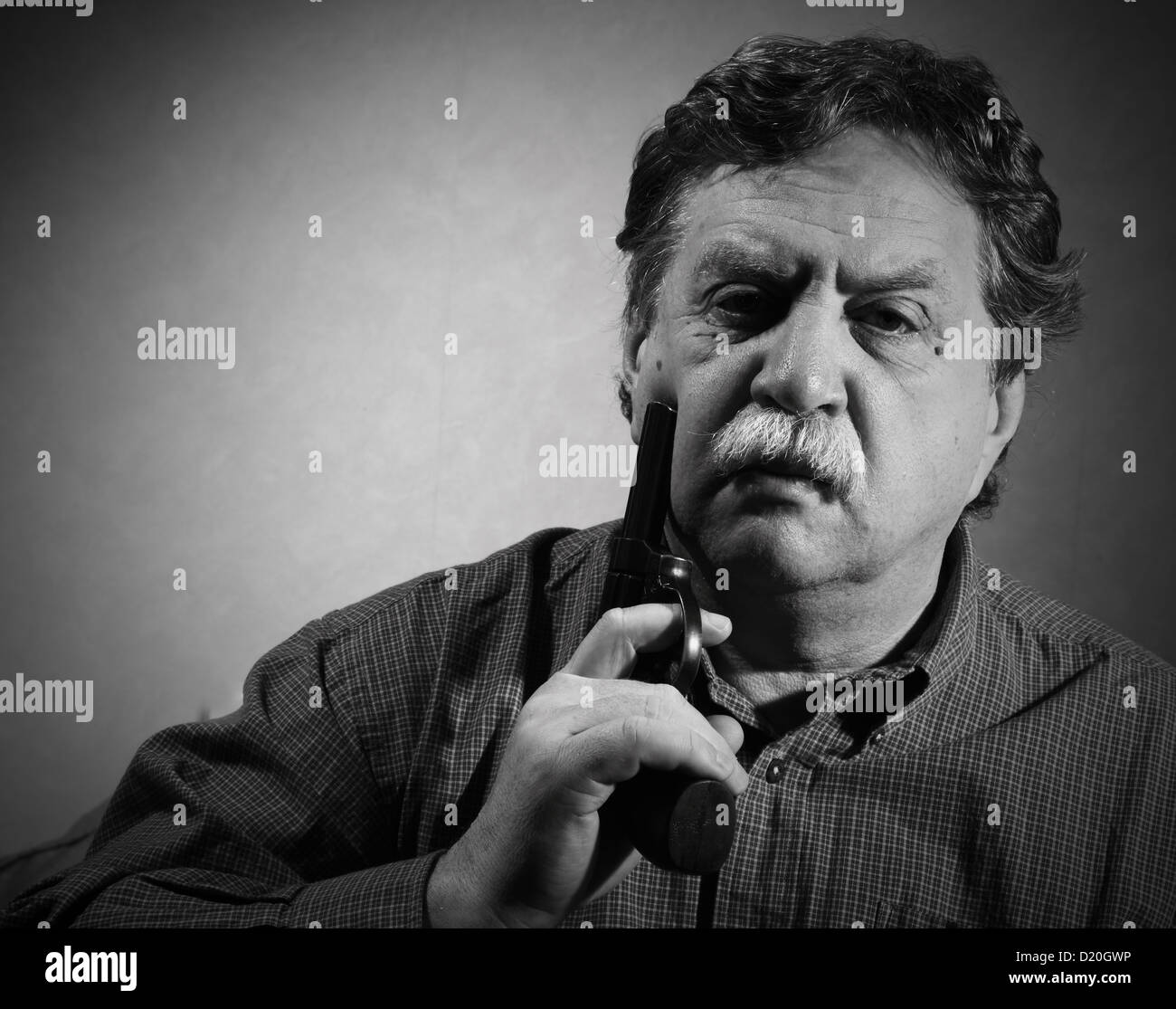middle aged man with a revolver Stock Photo - Alamy