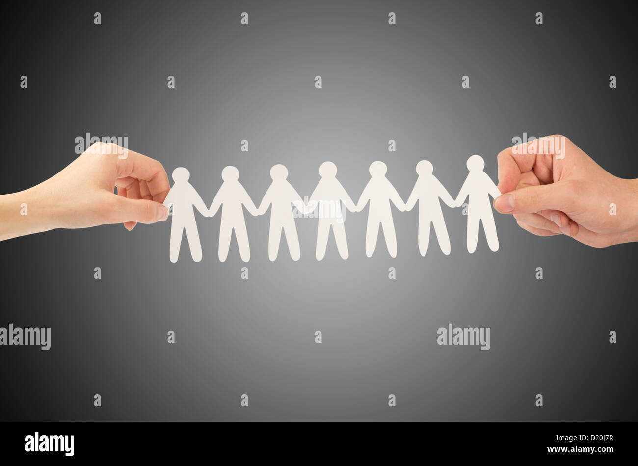 paper people in hands isolated on a white background Stock Photo - Alamy