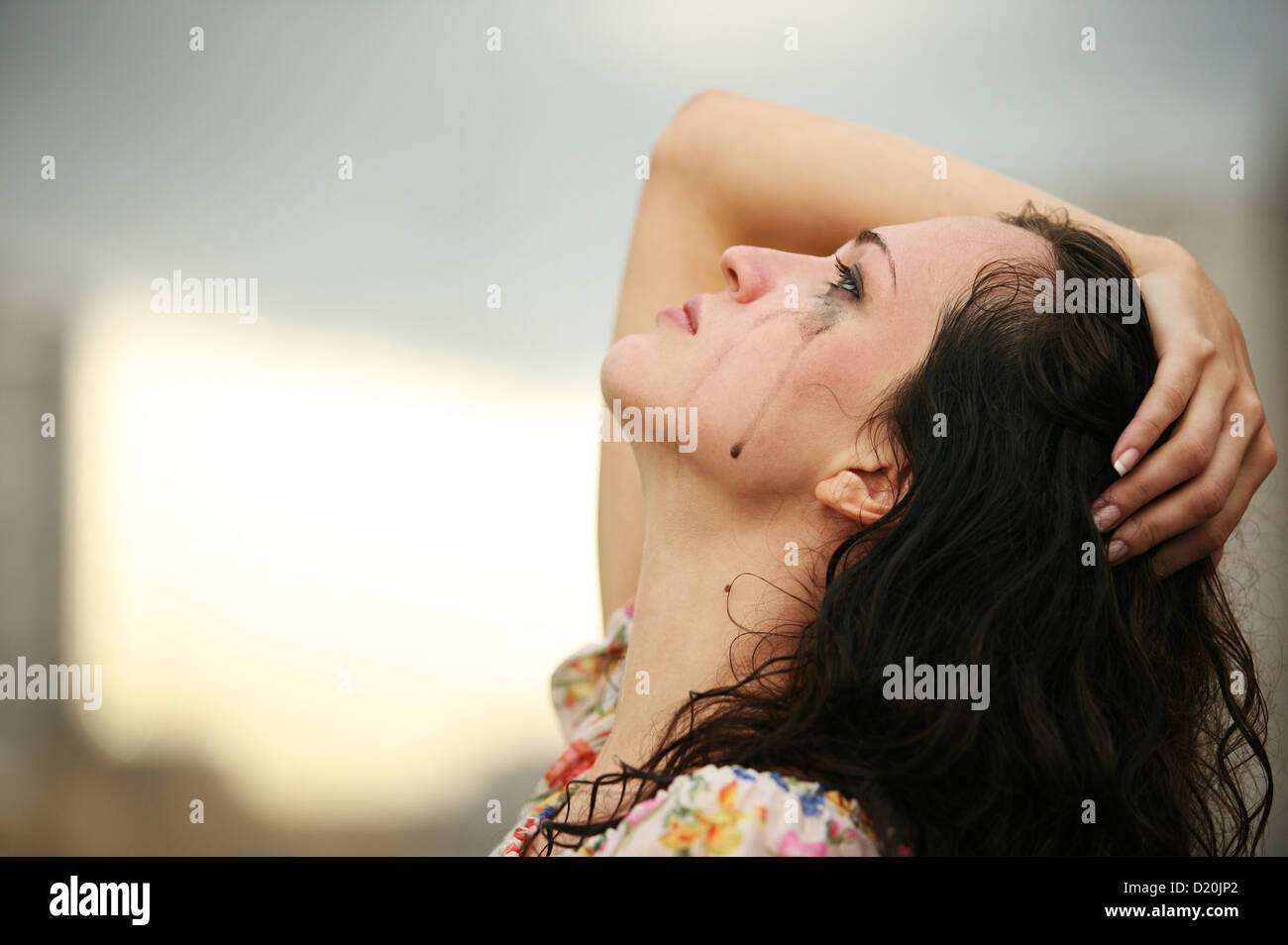 Portrait of a young crying brunette Stock Photo - Alamy