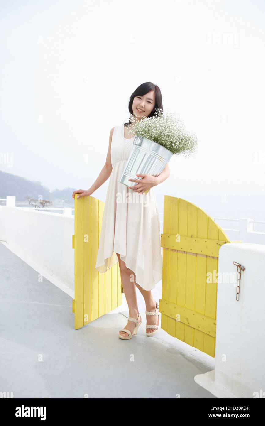 Woman smiling walking out of door hi-res stock photography and images ...
