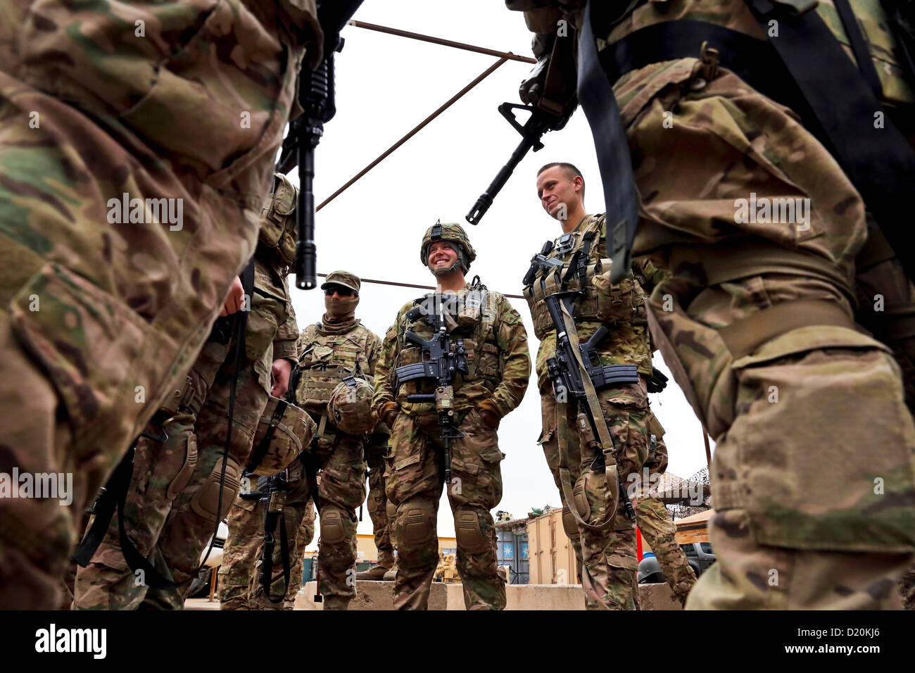 US Army forces conduct a security briefing before beginning a patrol ...