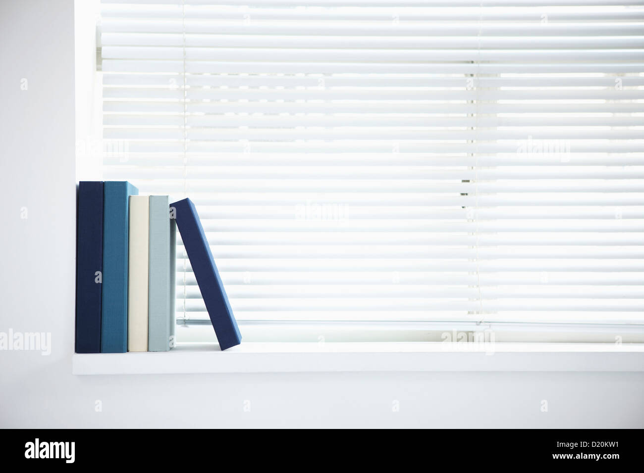 books standing on the window Stock Photo - Alamy