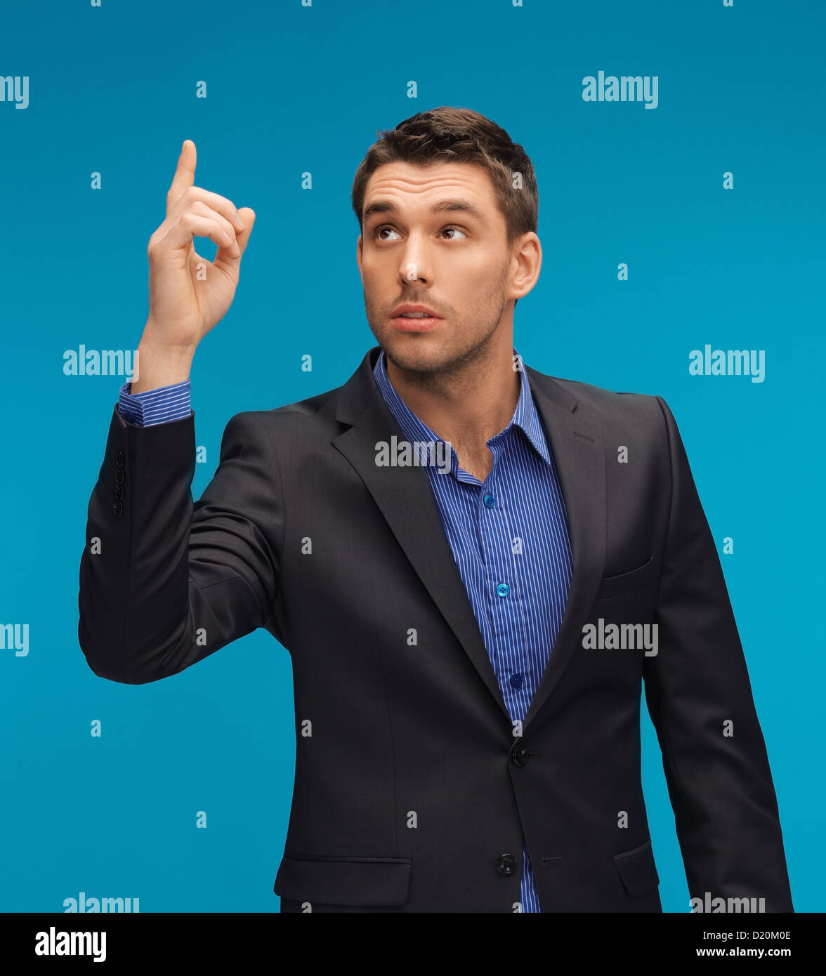 man in suit with his finger up Stock Photo - Alamy
