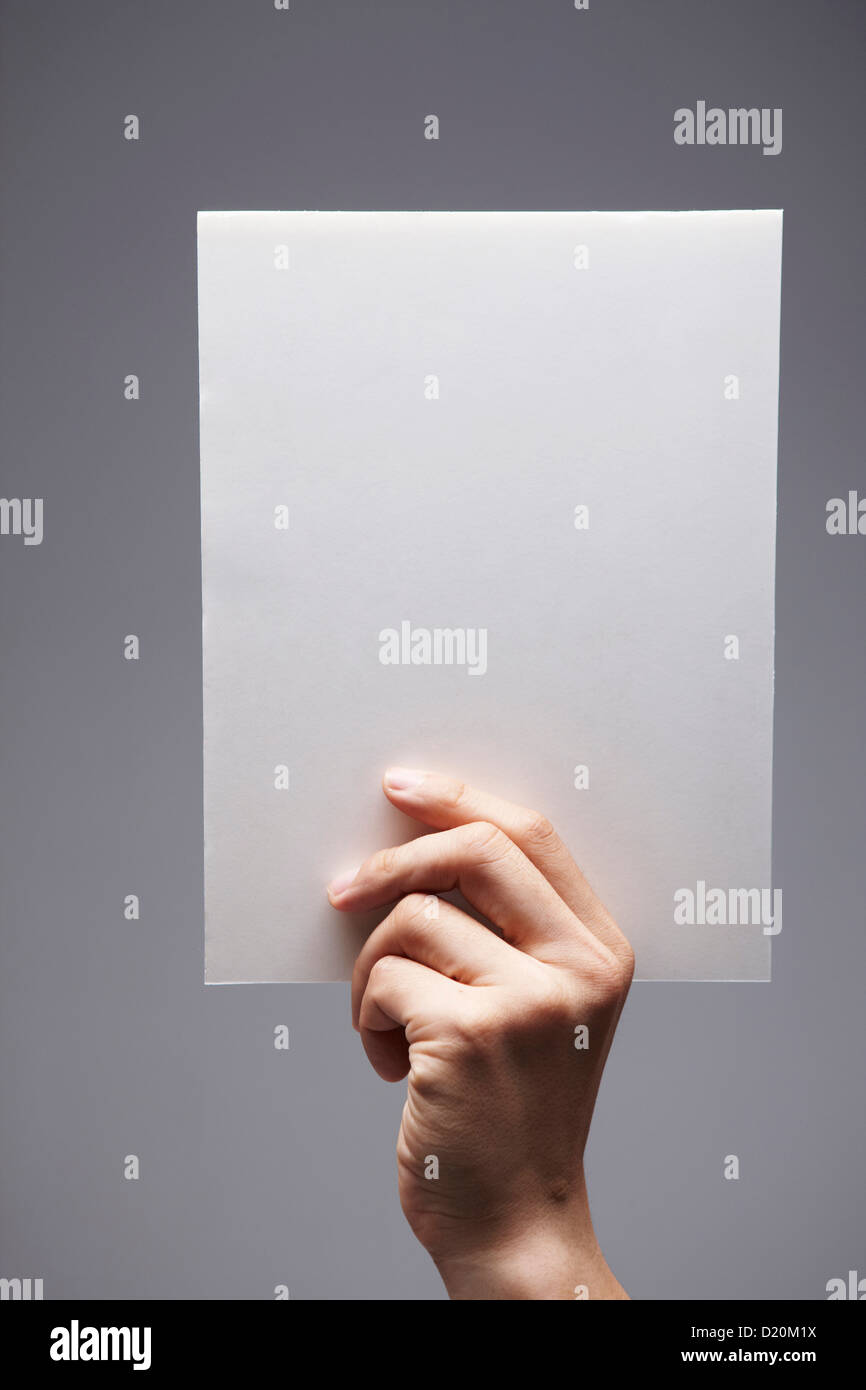 a piece of paper in hand Stock Photo - Alamy