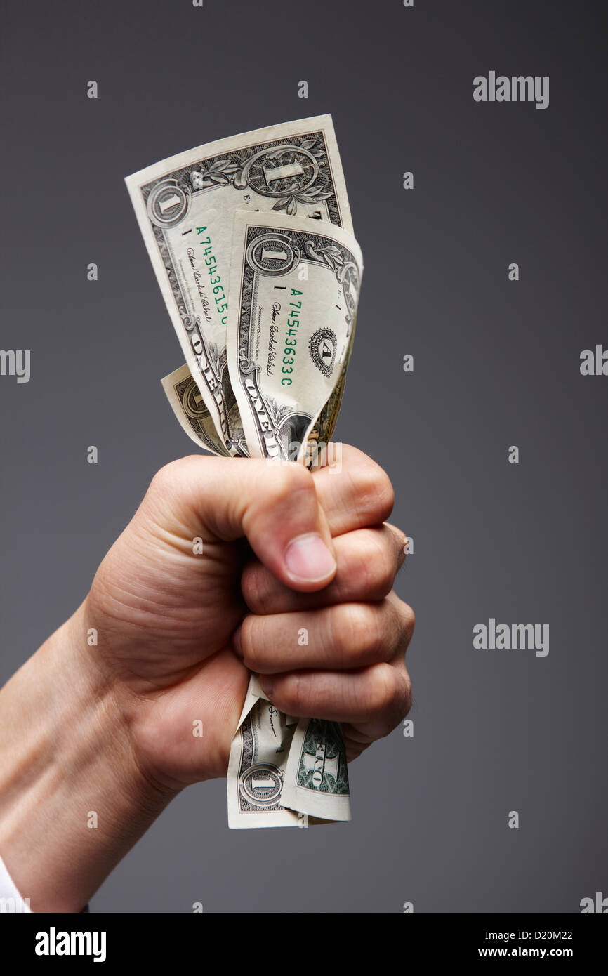 dollar bills in hand Stock Photo - Alamy