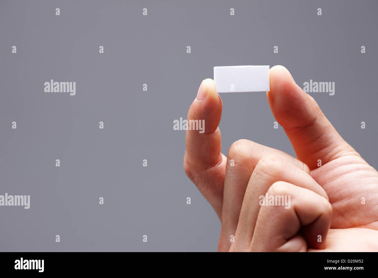 man holding a piece of paper Stock Photo - Alamy