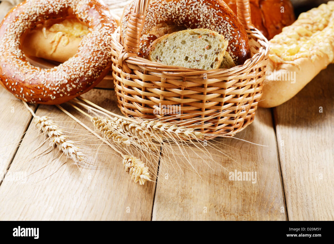 Group of bread loaves buns rolls on the wooden table Stock Photo - Alamy