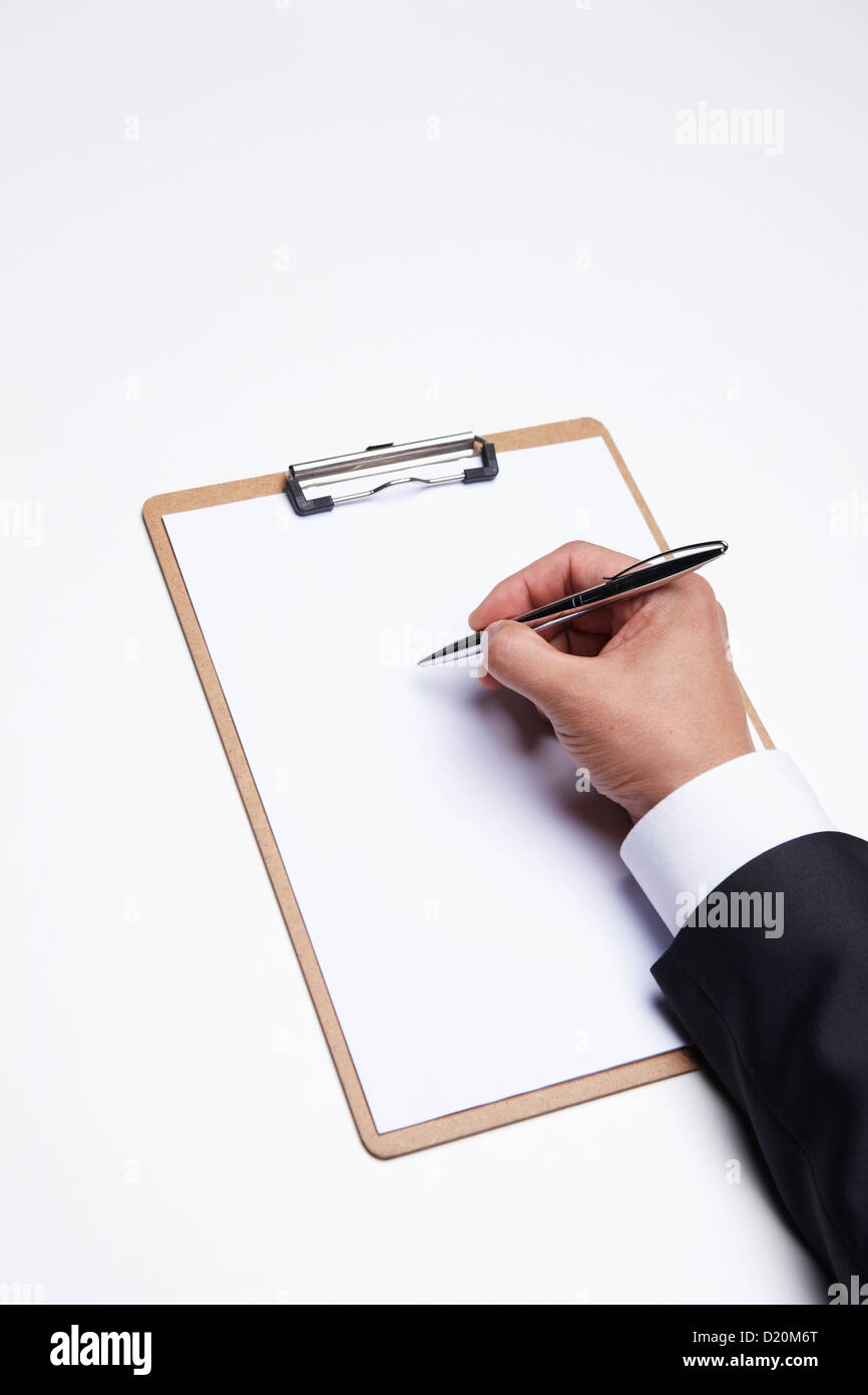 man writing on the paper with a pen Stock Photo - Alamy