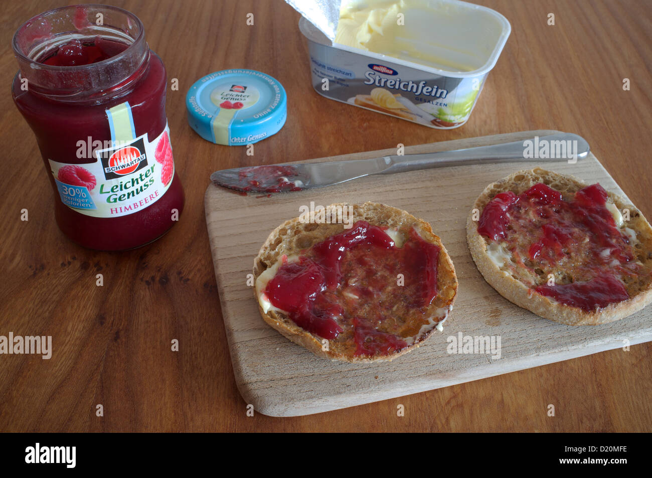Toasted muffin and raspberry jam (German Stock Photo - Alamy