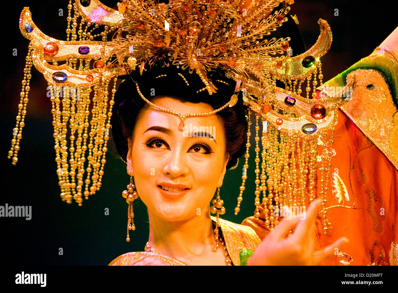 chinese woman wearing a fancy hairstyle and costume at a chinese artist ...