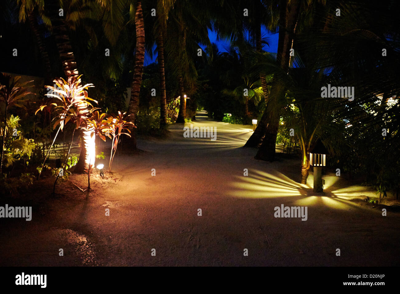 Lit path at night, Lily Beach Resort, Maldives Stock Photo - Alamy