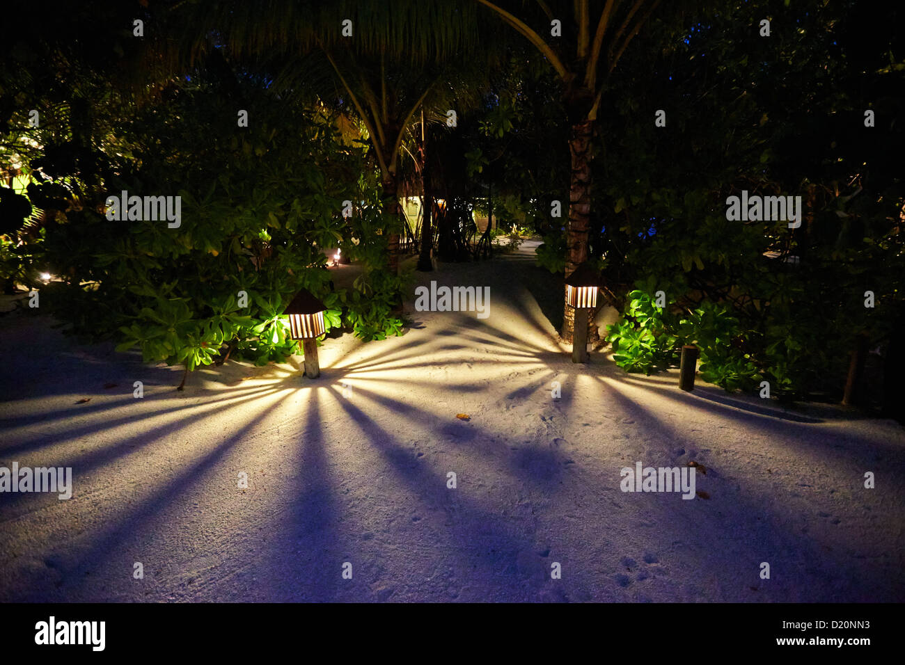 Lit path at night, Lily Beach Resort, Maldives Stock Photo - Alamy