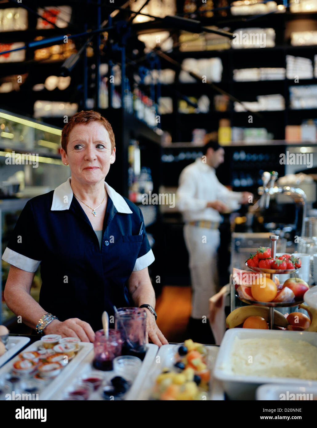 Waitress at the breakfast buffet in a hotel, Zeeburg, Amsterdam ...