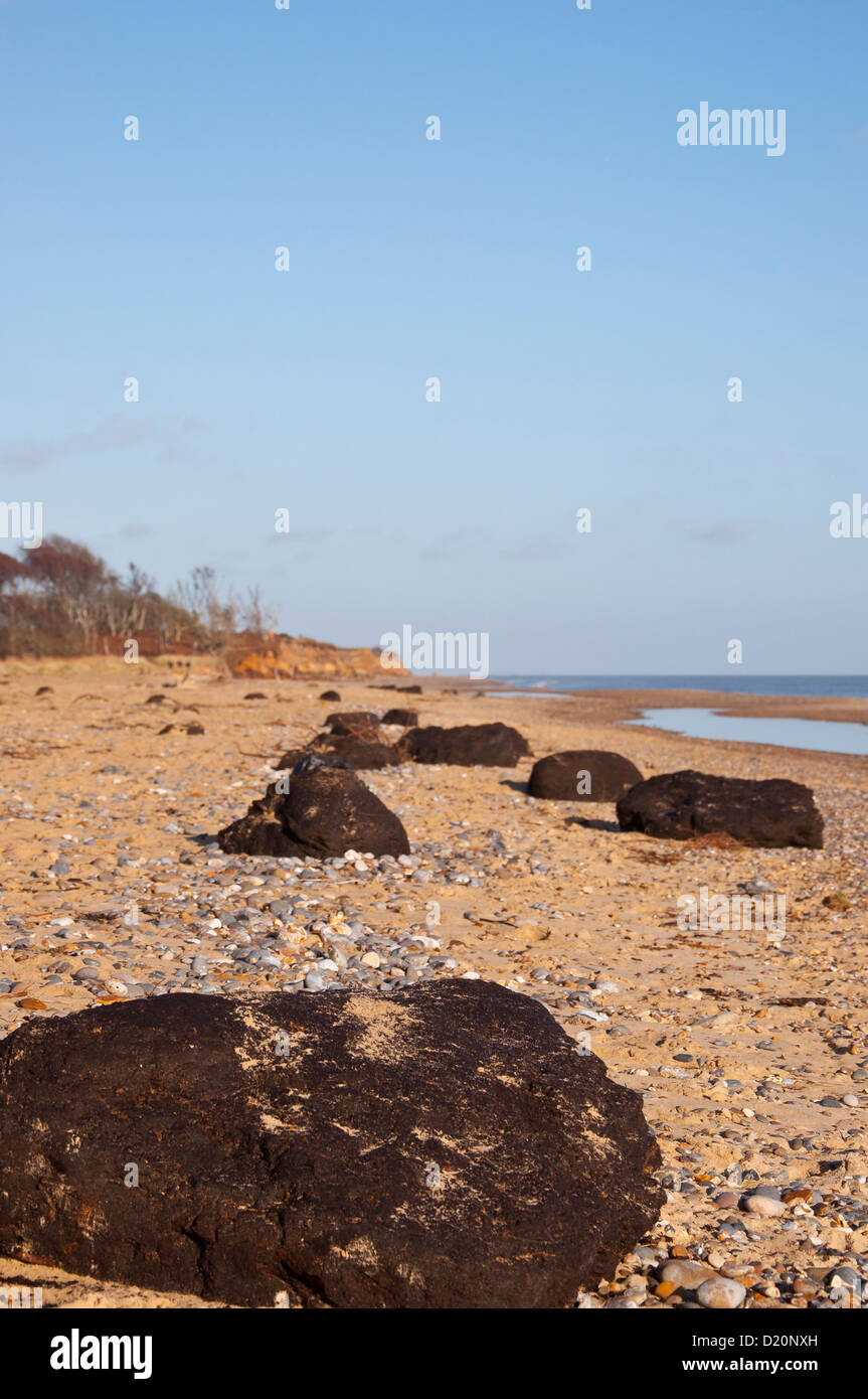 Large clumps of glacial mud on beach Stock Photo - Alamy