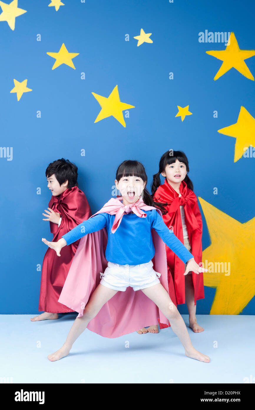 kids wearing superman capes posing Stock Photo - Alamy