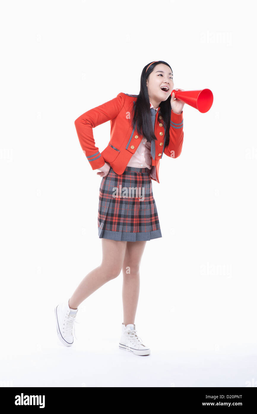 a female student speaking through a red megaphone Stock Photo - Alamy