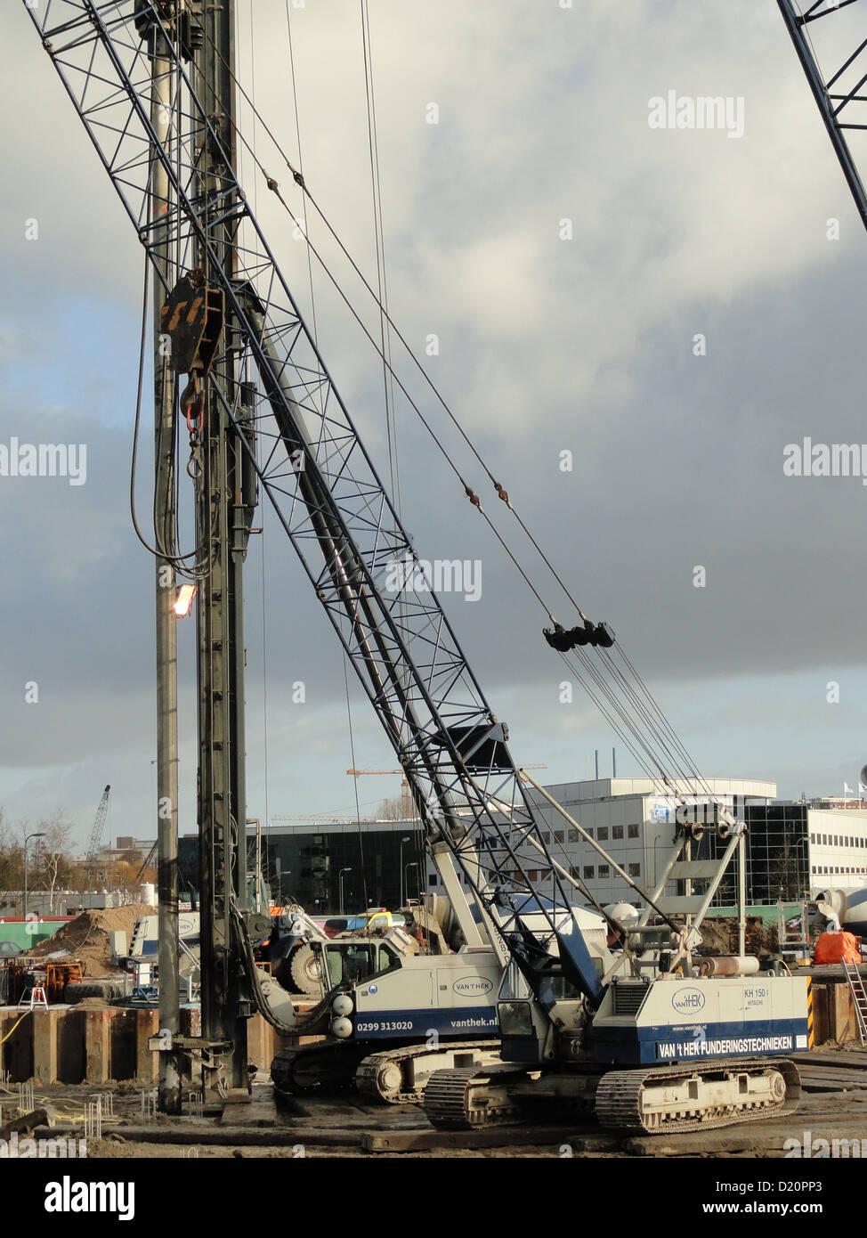 The Hitachi Crawler Crane KH 150 is a heavy-duty construction machine ...