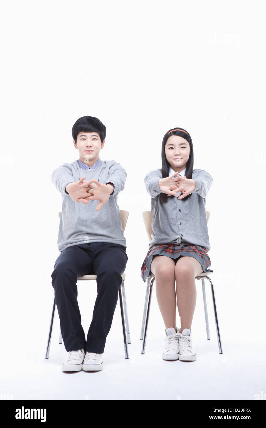 a female and male students stretching their arms Stock Photo - Alamy