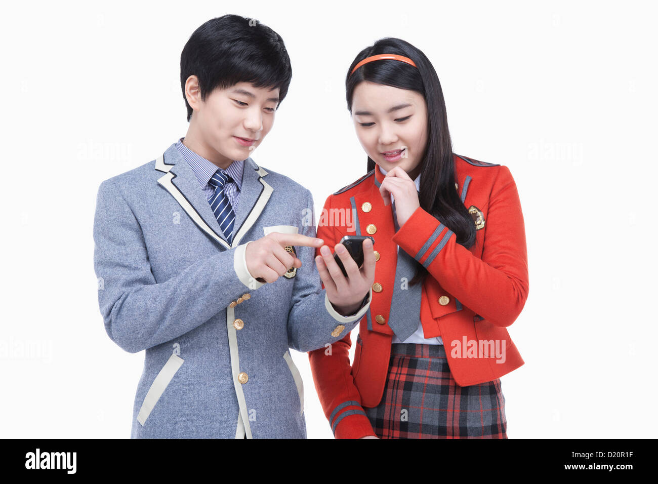 a male student showing his mobile phone to a female student Stock Photo ...