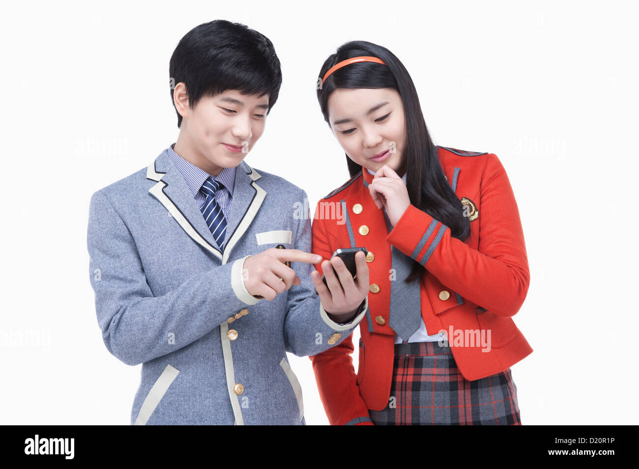 a male student showing his mobile phone to a female student Stock Photo ...
