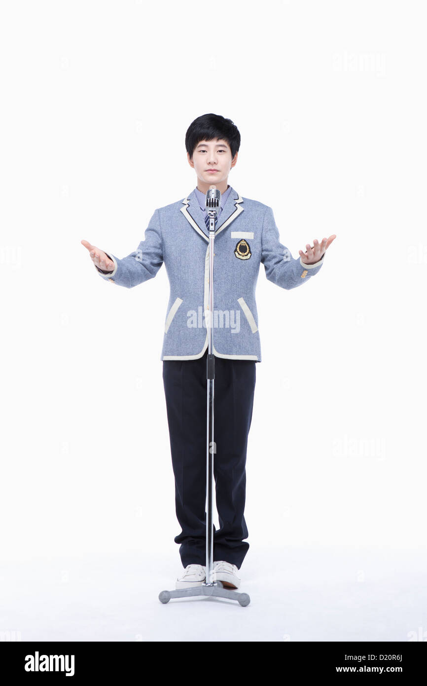a male student standing with his arms open Stock Photo - Alamy